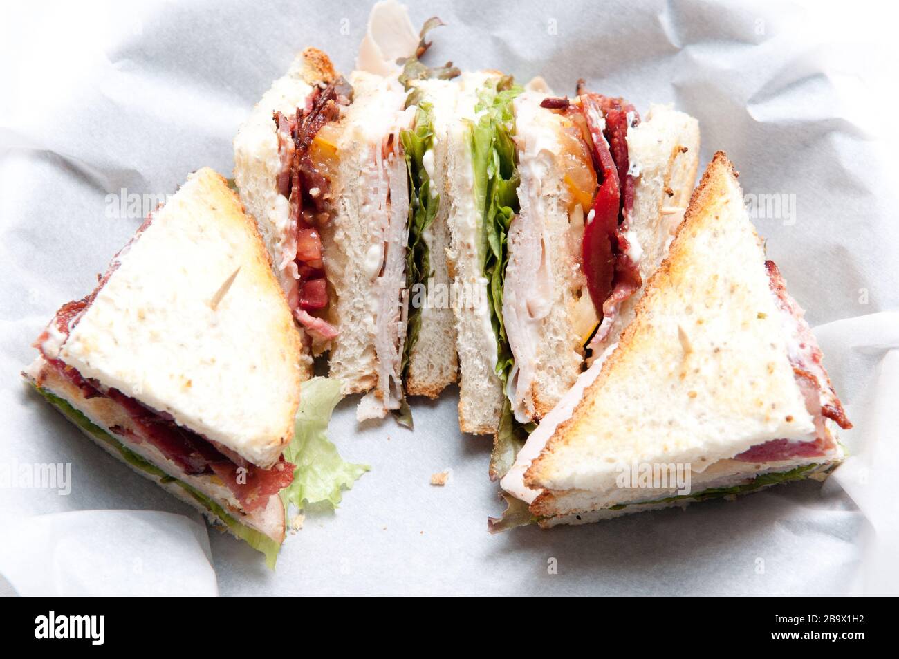 A clubhouse sandwich with fries Stock Photo - Alamy