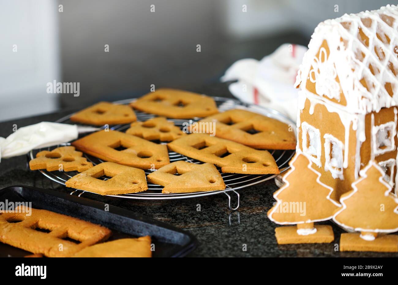 Making of christmas gingerbread house and cookies Stock Photo - Alamy