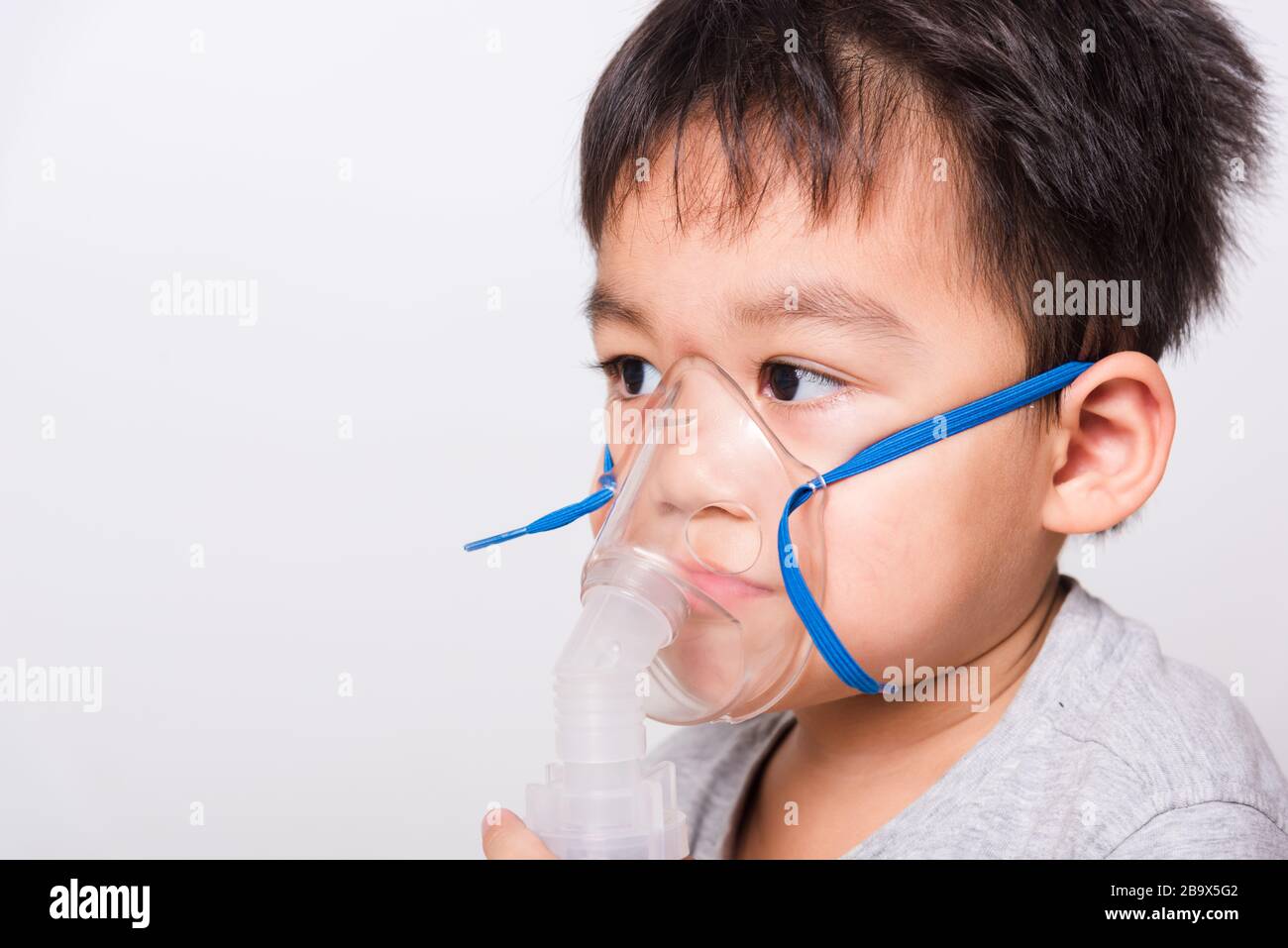 Closeup Asian face, Little children boy sick he using steam inhaler ...