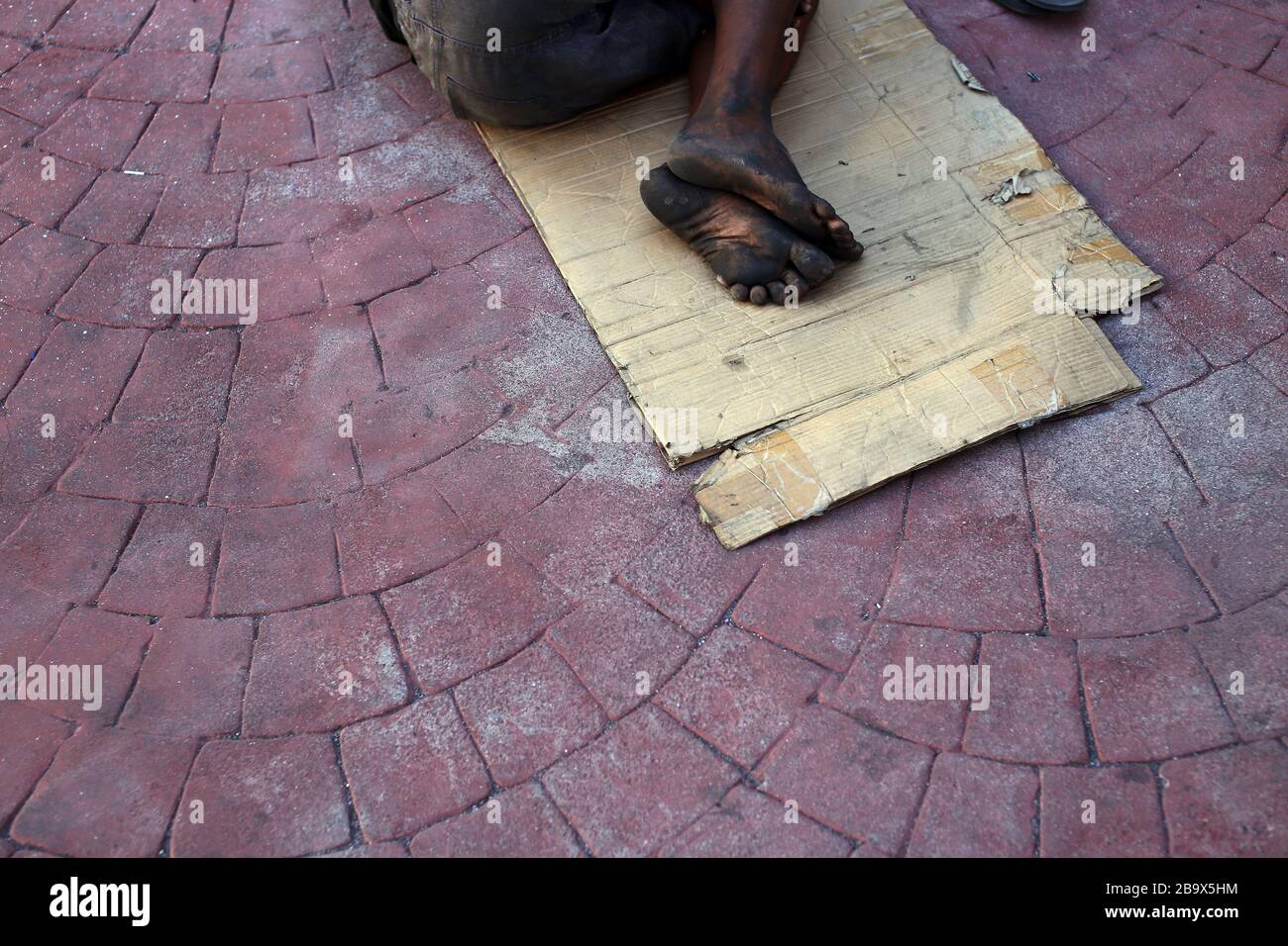 Manila, Philippines. 25th Mar, 2020. A homeless man sleeps on the ...