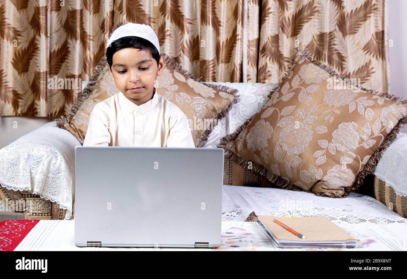 Happy indian using laptop hi-res stock photography and images - Alamy