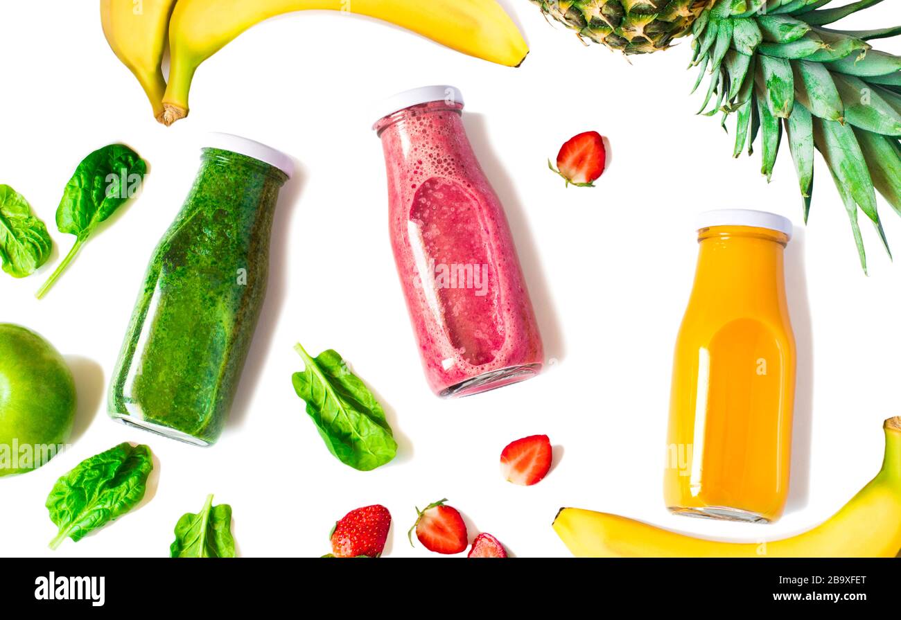 Colorful smoothies in bottles isolated on white background, top view ...