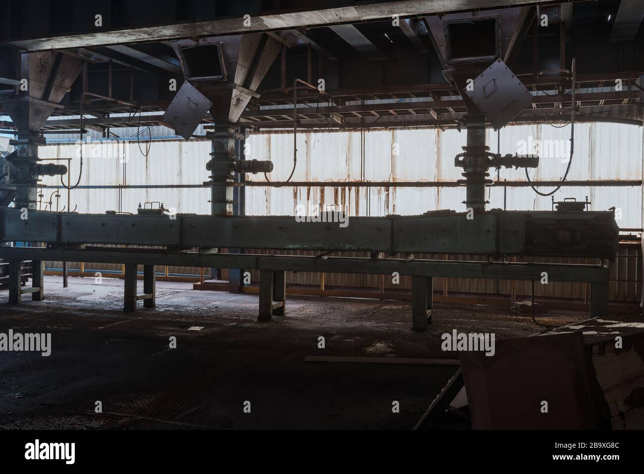 Interior of an old abandoned industrial steel factory Stock Photo - Alamy