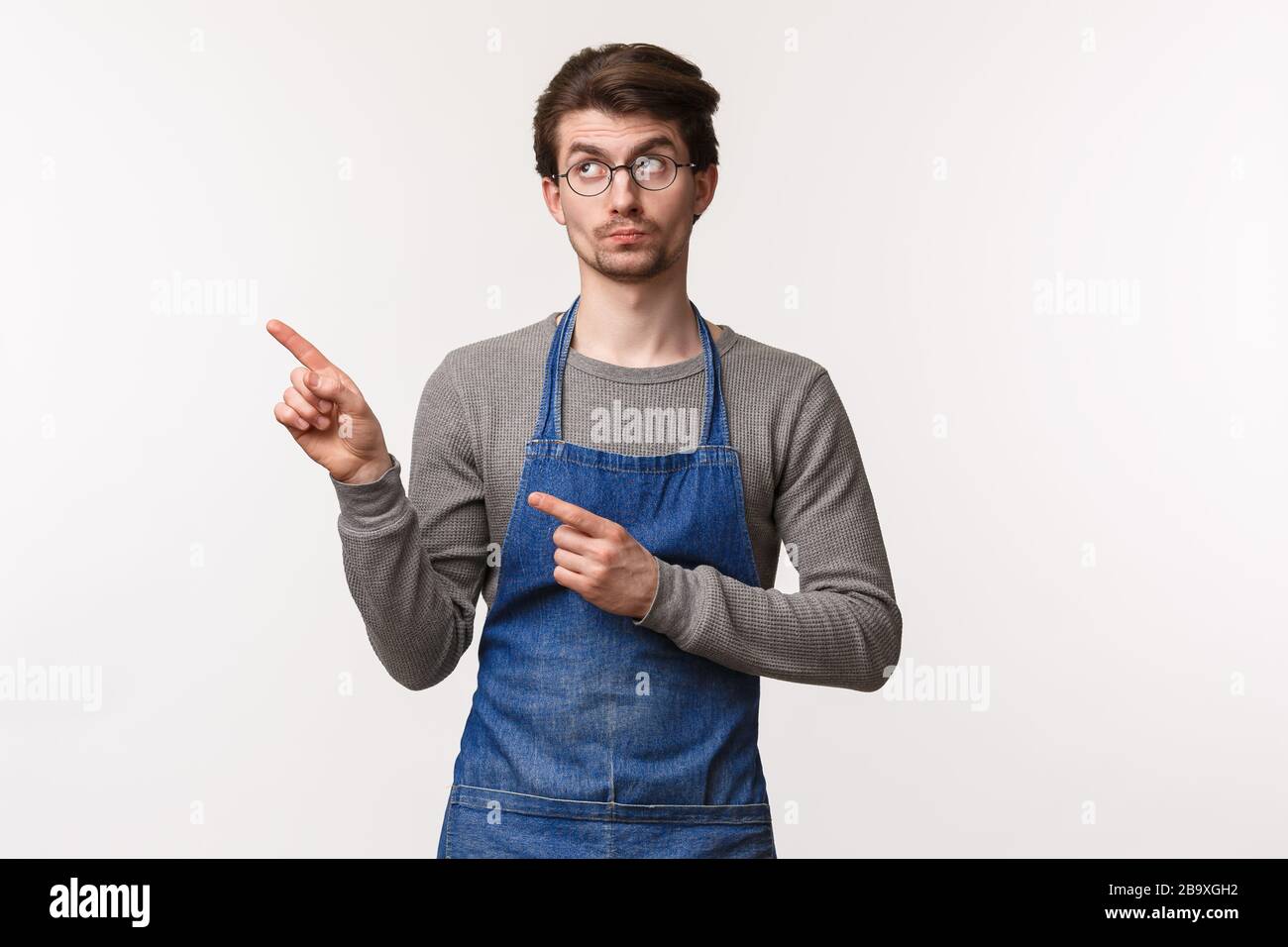 Portrait of curious and indecisive handsome male entrepreneur, coffee ...
