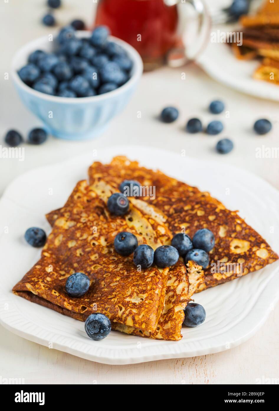 Crepes with blueberries and maple syrup Stock Photo - Alamy