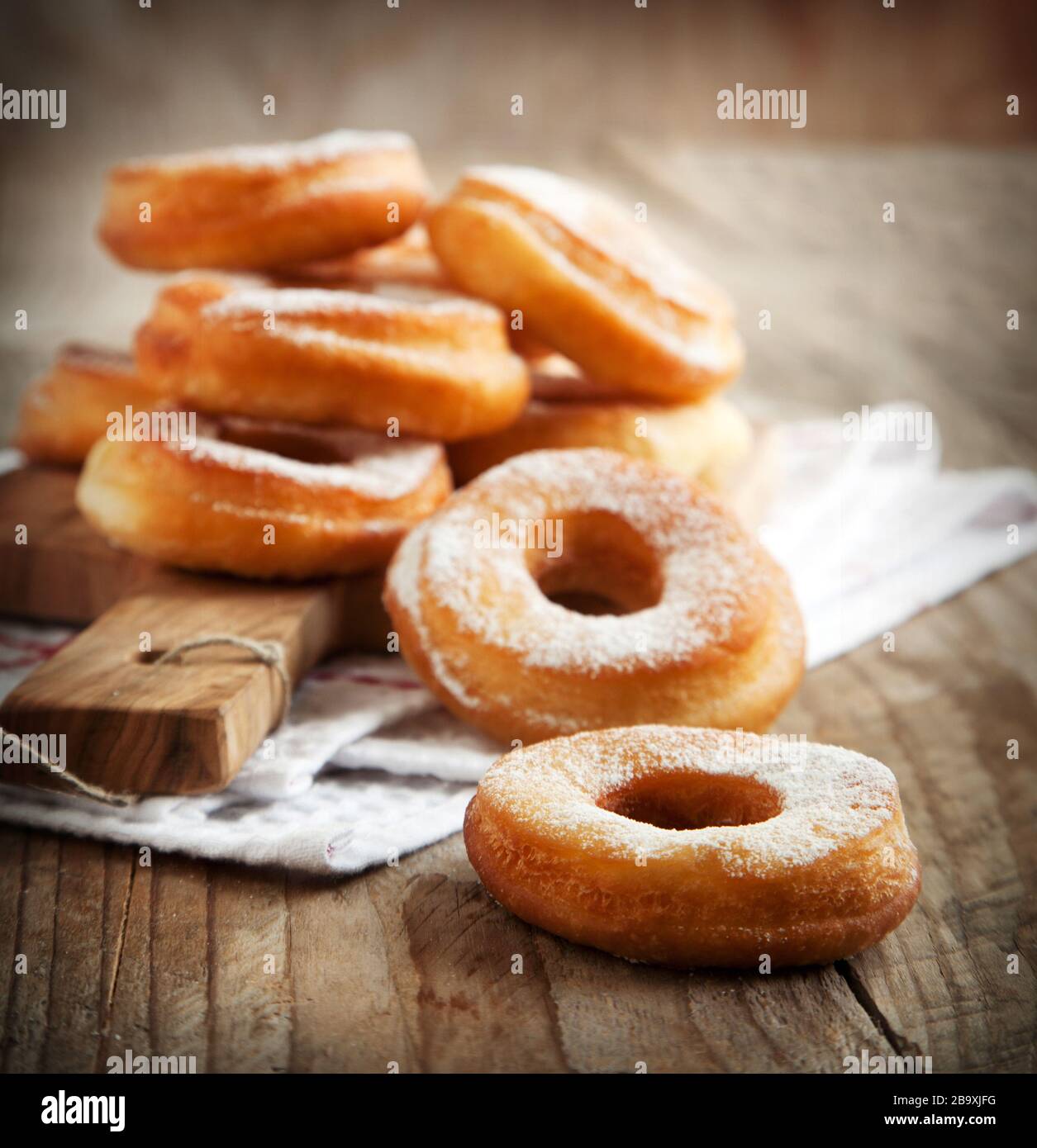 Fresh donuts with powder sugar Stock Photo - Alamy
