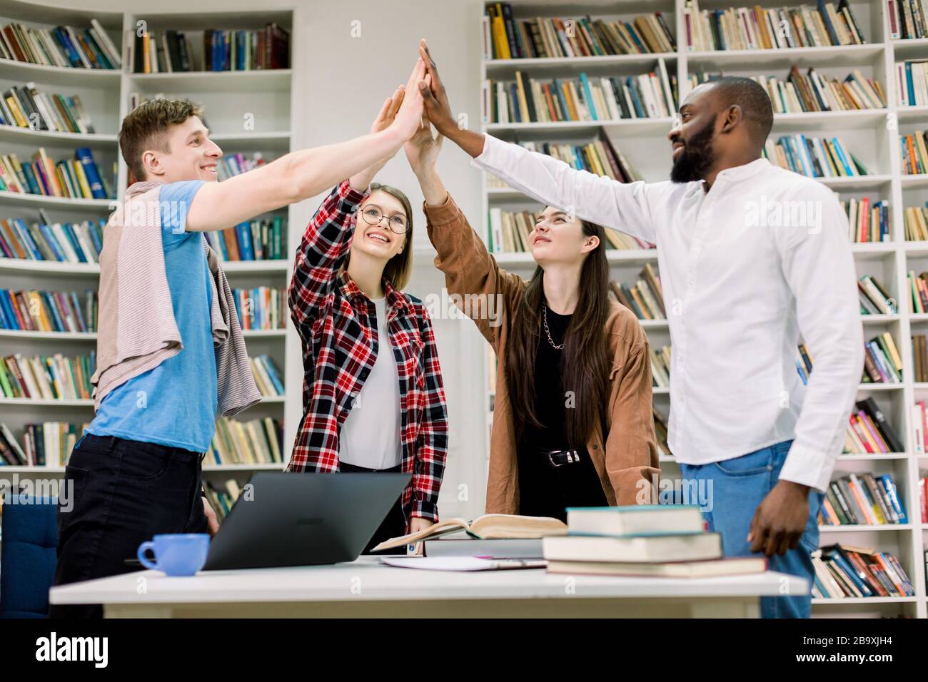 Happy satisfied attractive young multiethnic people, students or ...