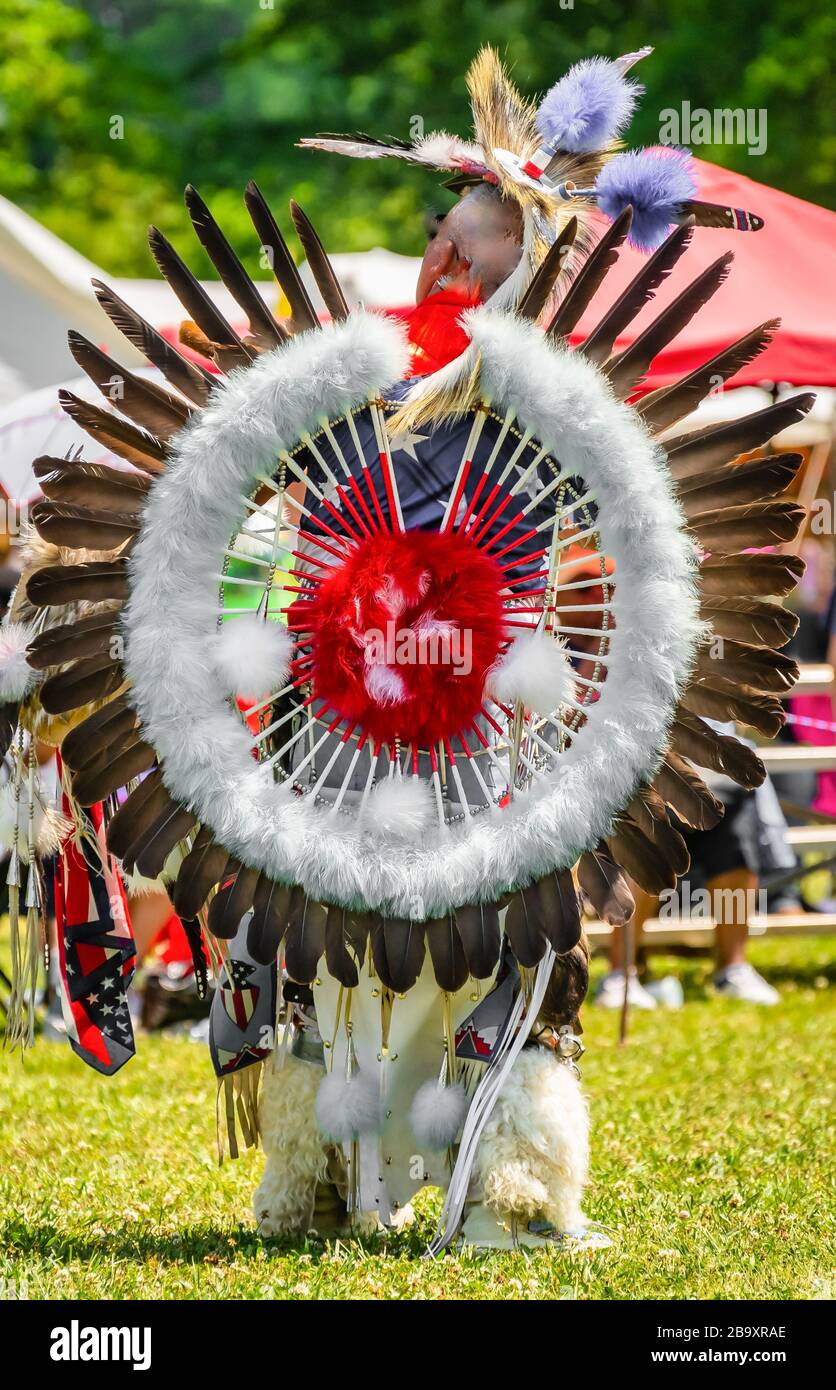 Vertical closeup shot of a person in a colorful Native Indian-American ...