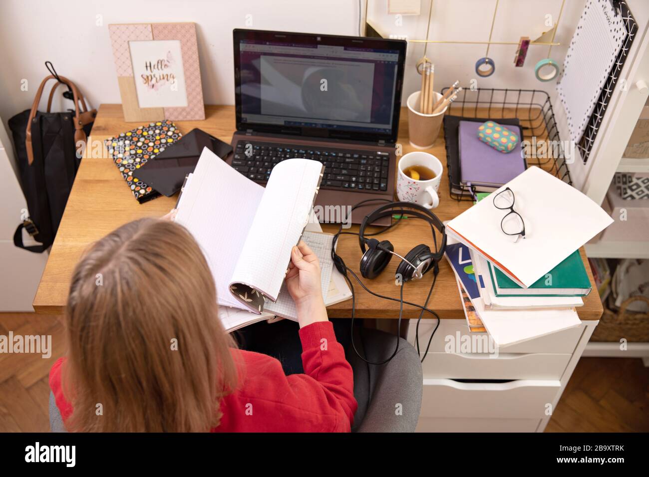 Coronavirus quarantine concept. cute student working on a laptop at ...