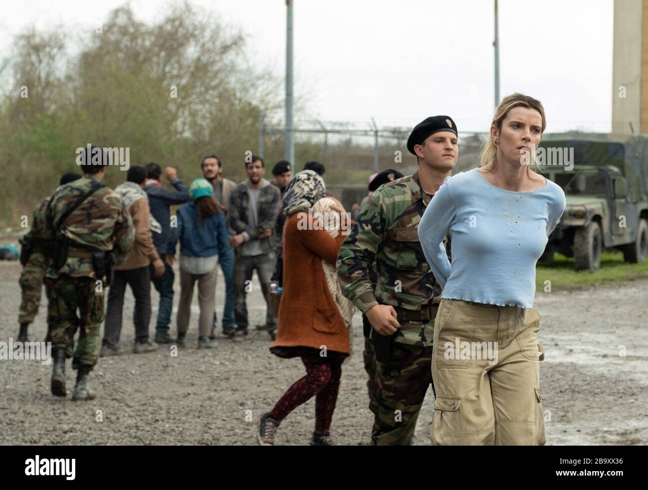 THE HUNT, foreground from left: Yosef Kasnetzkov, Betty Gilpin, 2020 ...