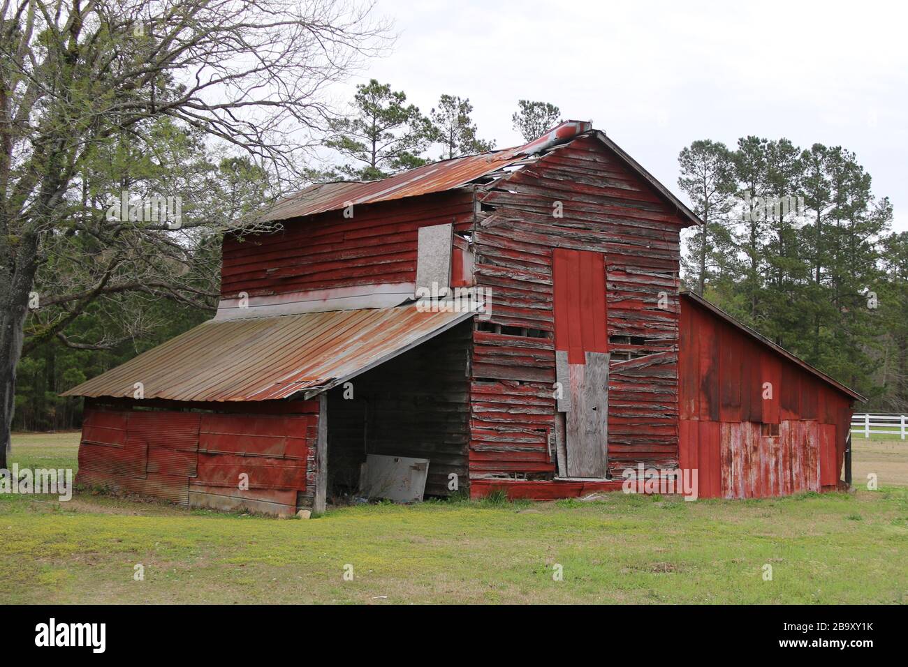 a vintage old red country farm barn in a grass field Stock Photo - Alamy