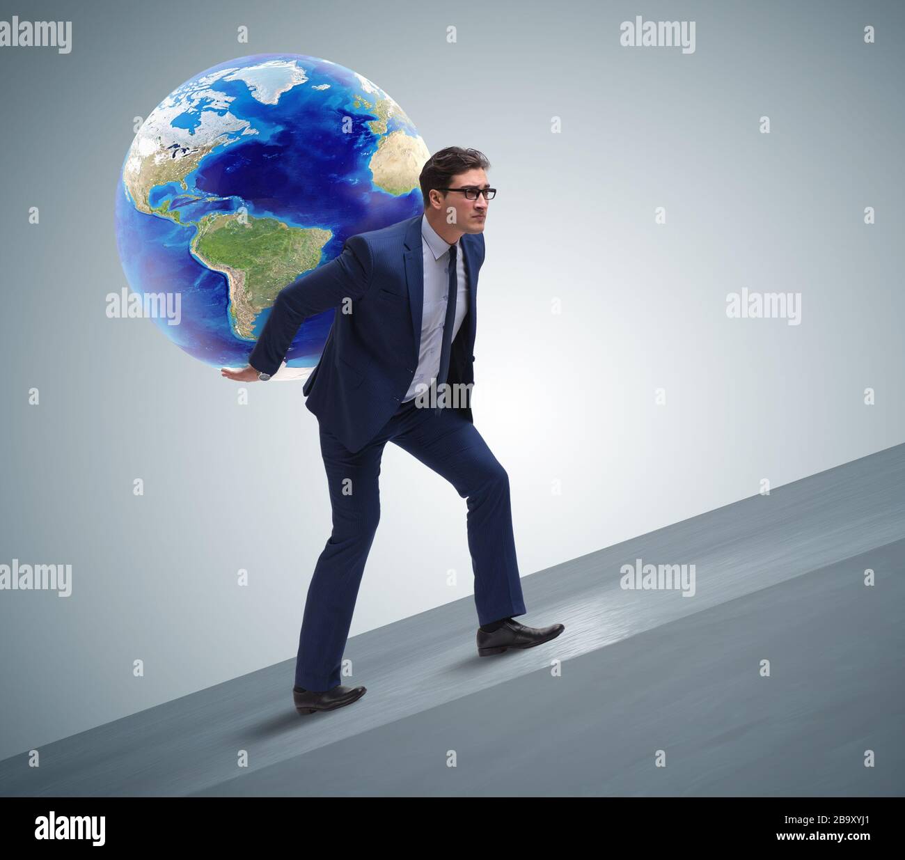 The businessman carrying earth on his shoulders Stock Photo - Alamy