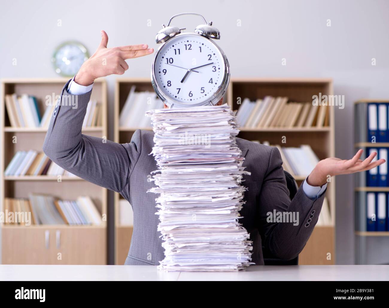 The businessman struggling to meet challenging deadlines Stock Photo ...