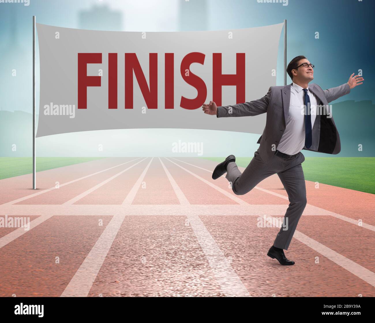 The businessman on the finishing line in competition concept Stock ...