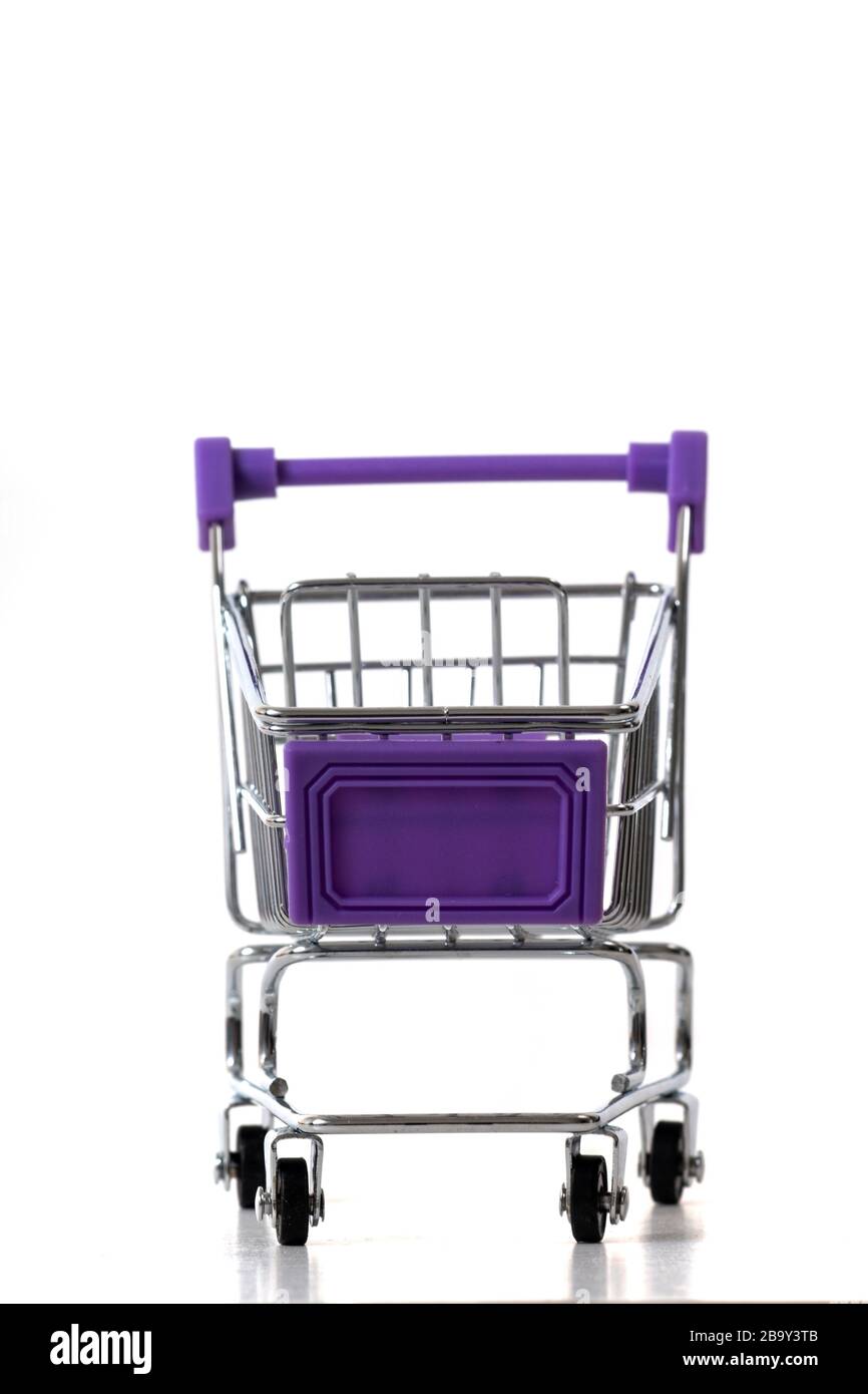 Miniature shopping cart isolated on white background Stock Photo - Alamy