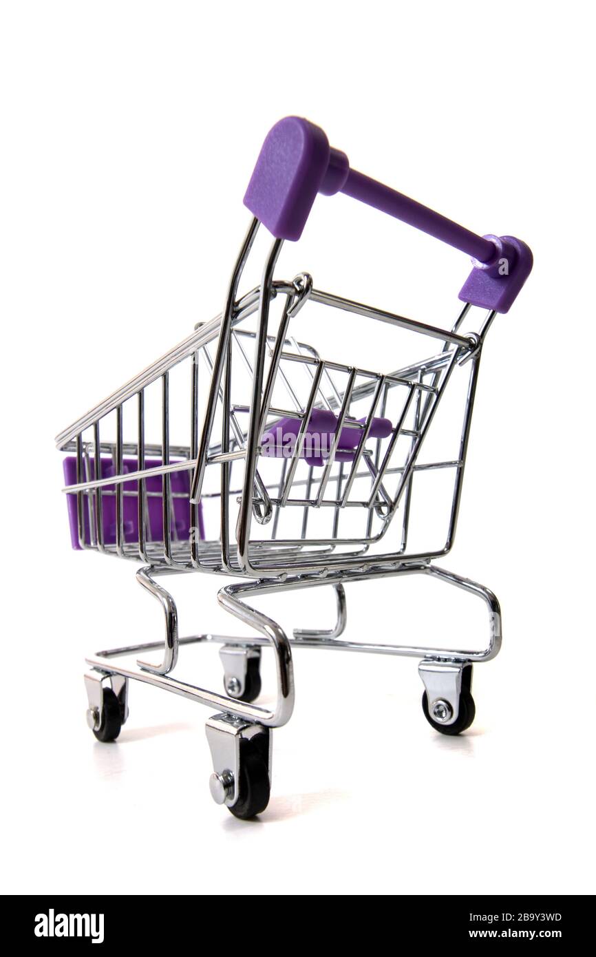 Miniature shopping cart isolated on white background Stock Photo - Alamy