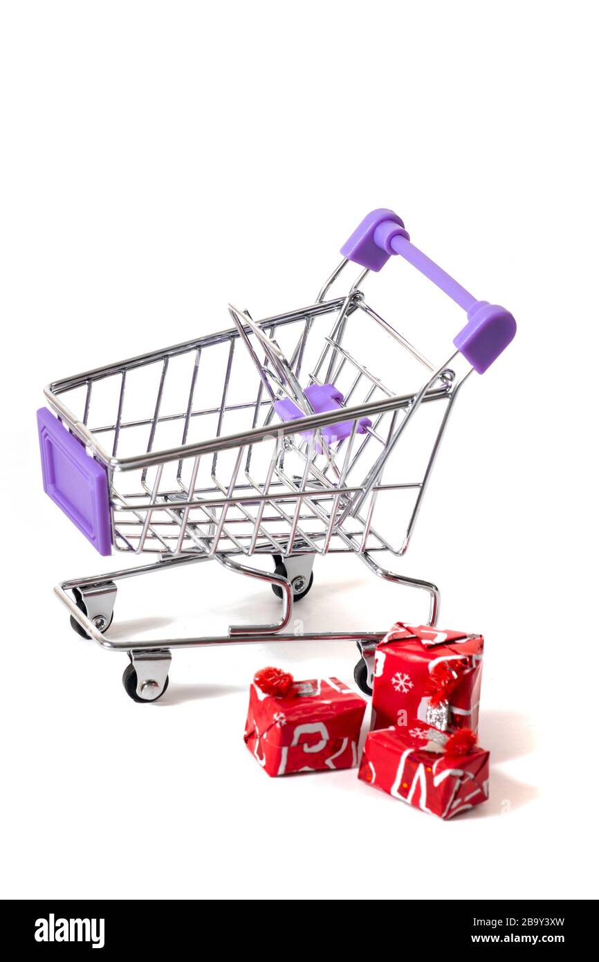 Miniature shopping cart isolated on white background Stock Photo - Alamy