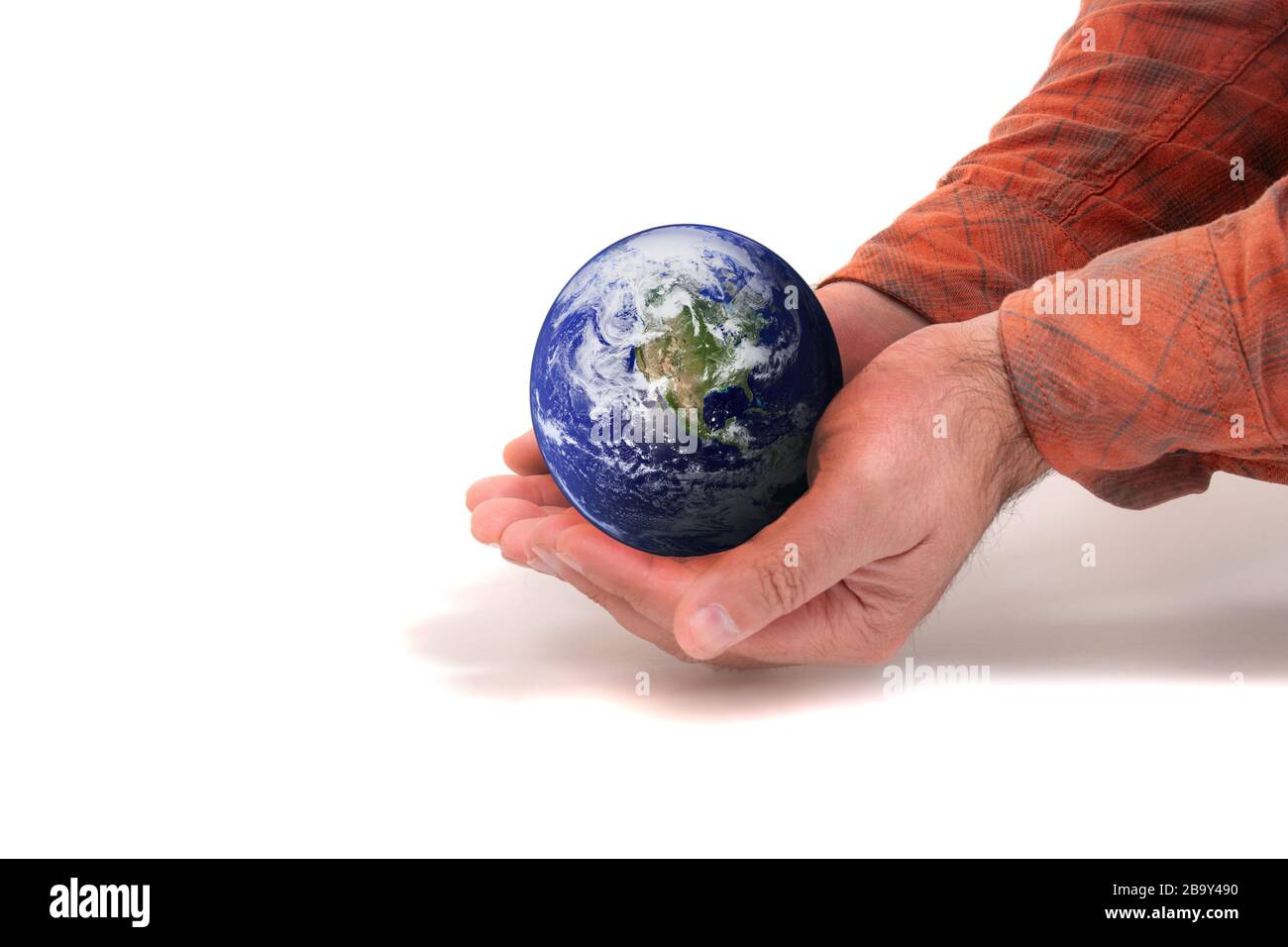 man hands holding Planet Earth on a white background. Some Elements of ...