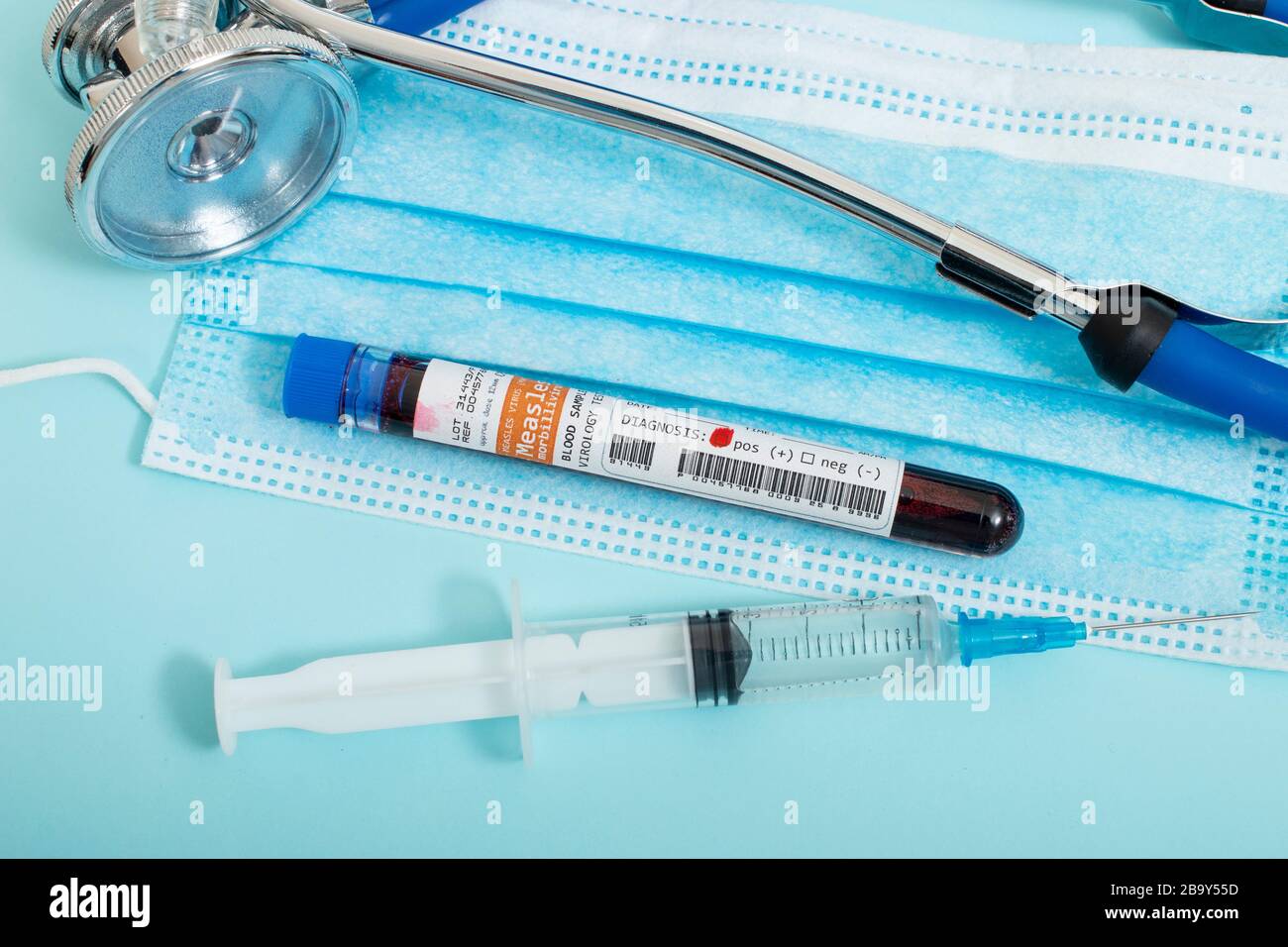 Fictional Blood samples with infected measles virus, with stethoscope ...