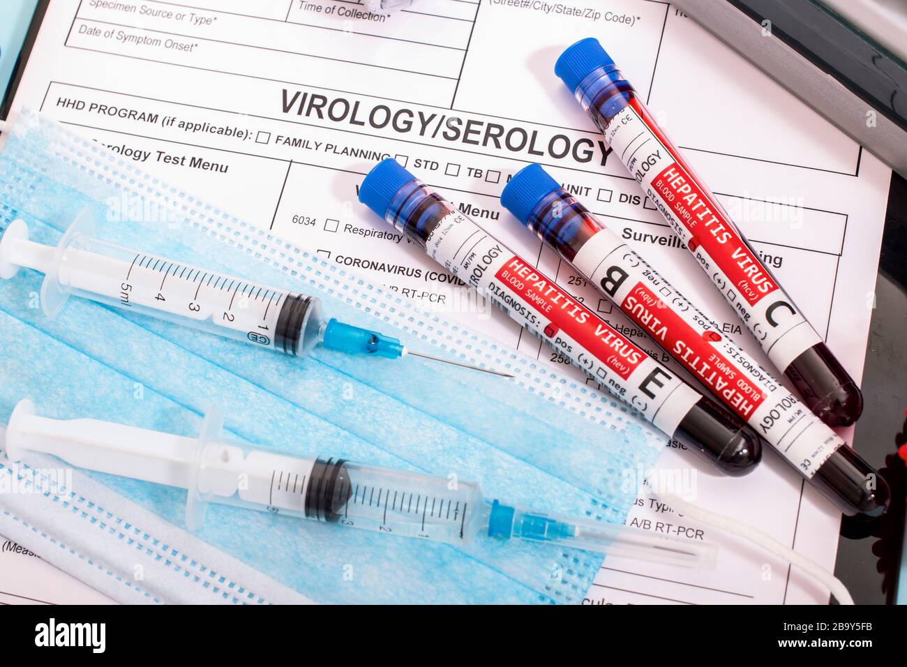 Fictional Blood samples with infected Hepatitis virus, mask, syringe ...