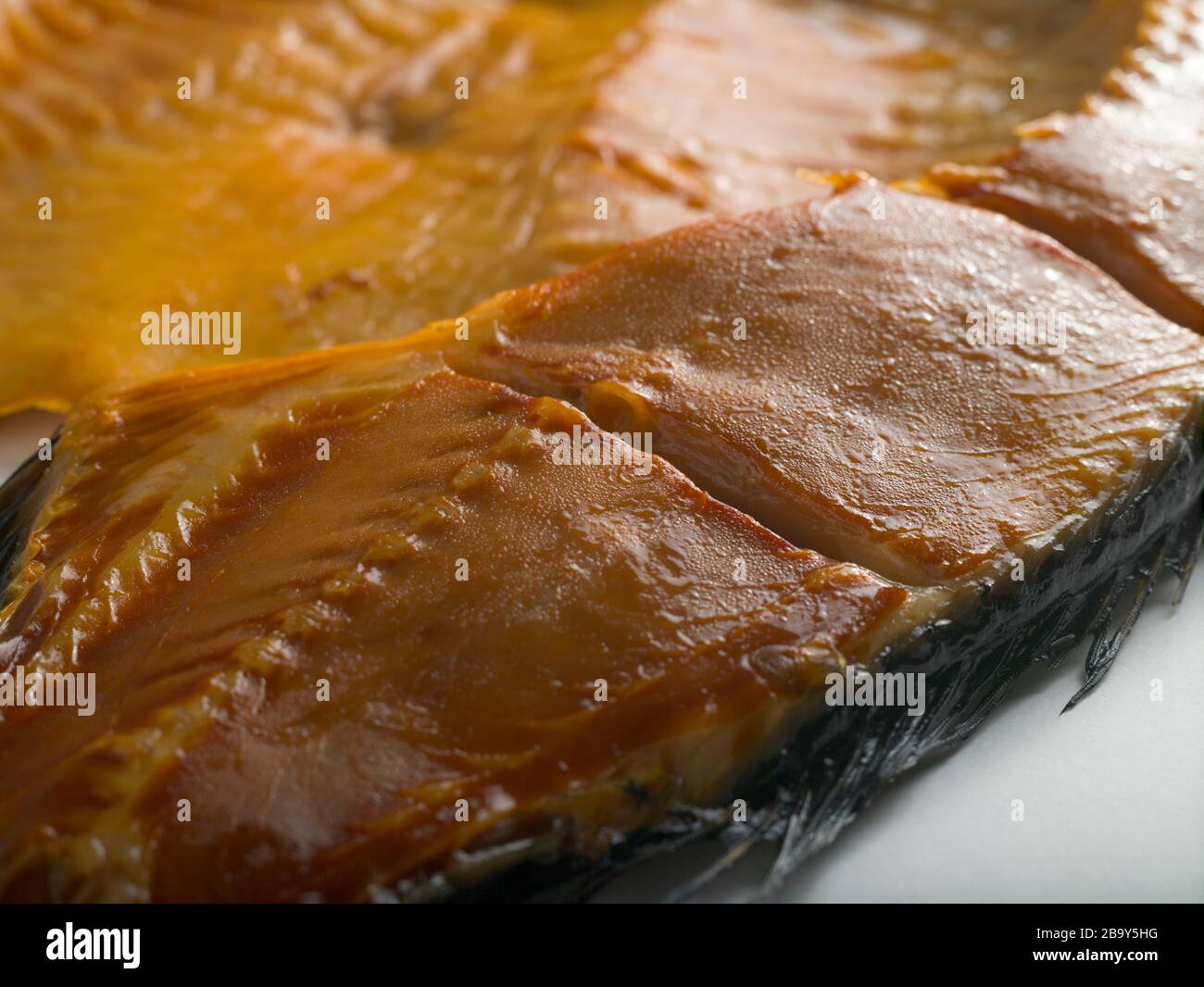 Delicacy. Cold smoked golden carp. Cold smoked fish. Studio light Stock ...