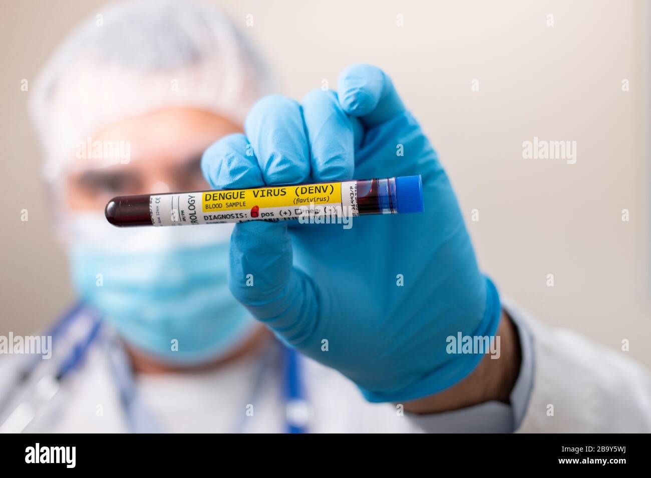 View of a doctor holding a fictional test tube blood sample, infected ...
