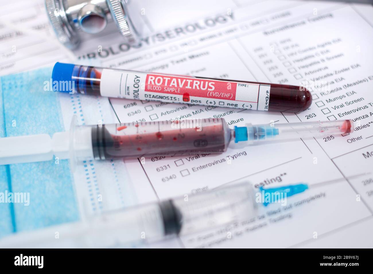 Fictional Blood samples with infected Rotavirus, with mask, syringe and ...