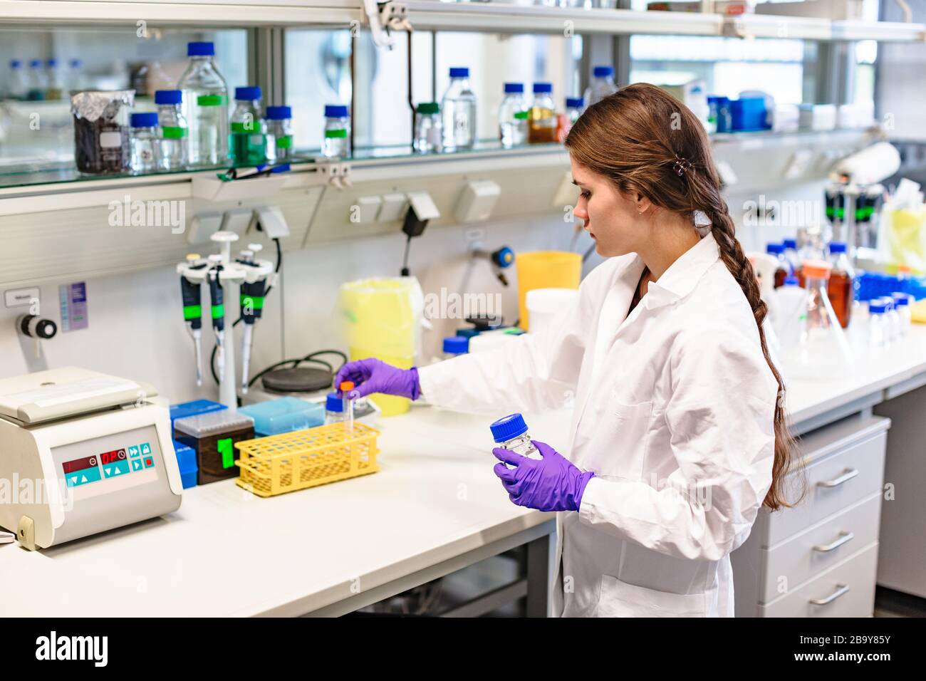 Chemical lab flask woman hi-res stock photography and images - Alamy