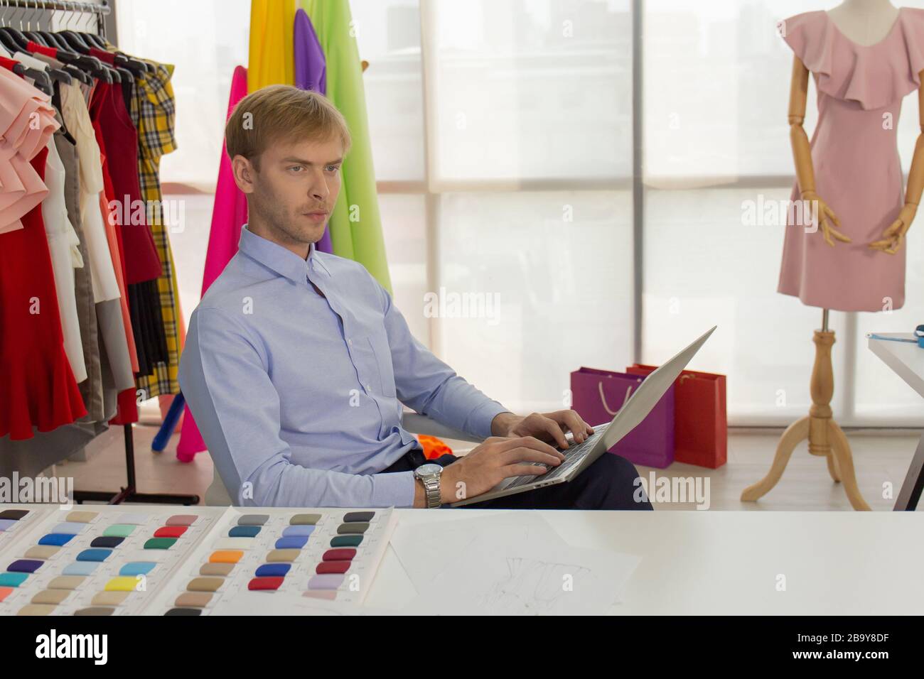 Professional male sewing designers in the office have a variety of ...