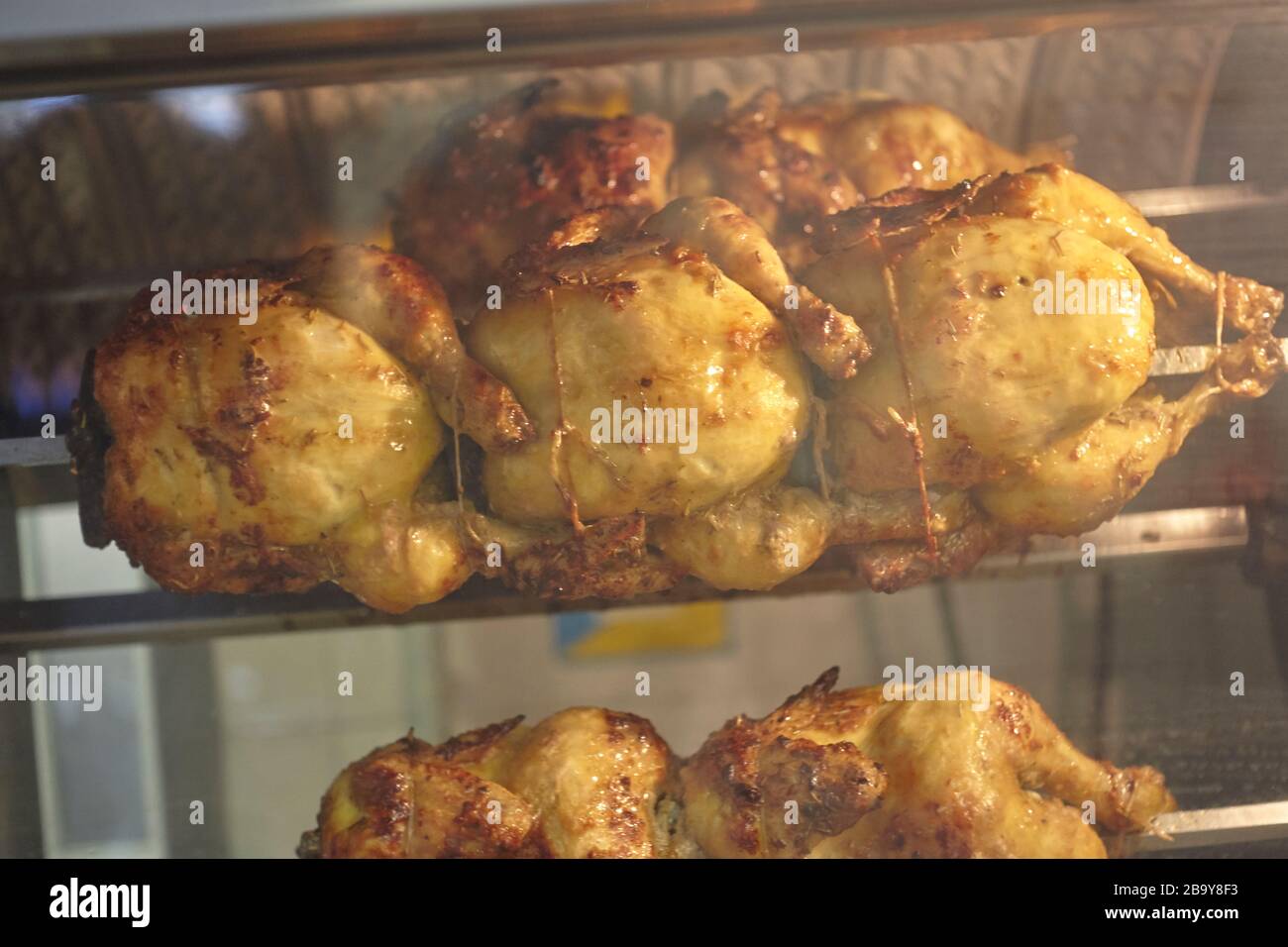 Rotisserie chickens cooking hi-res stock photography and images - Alamy
