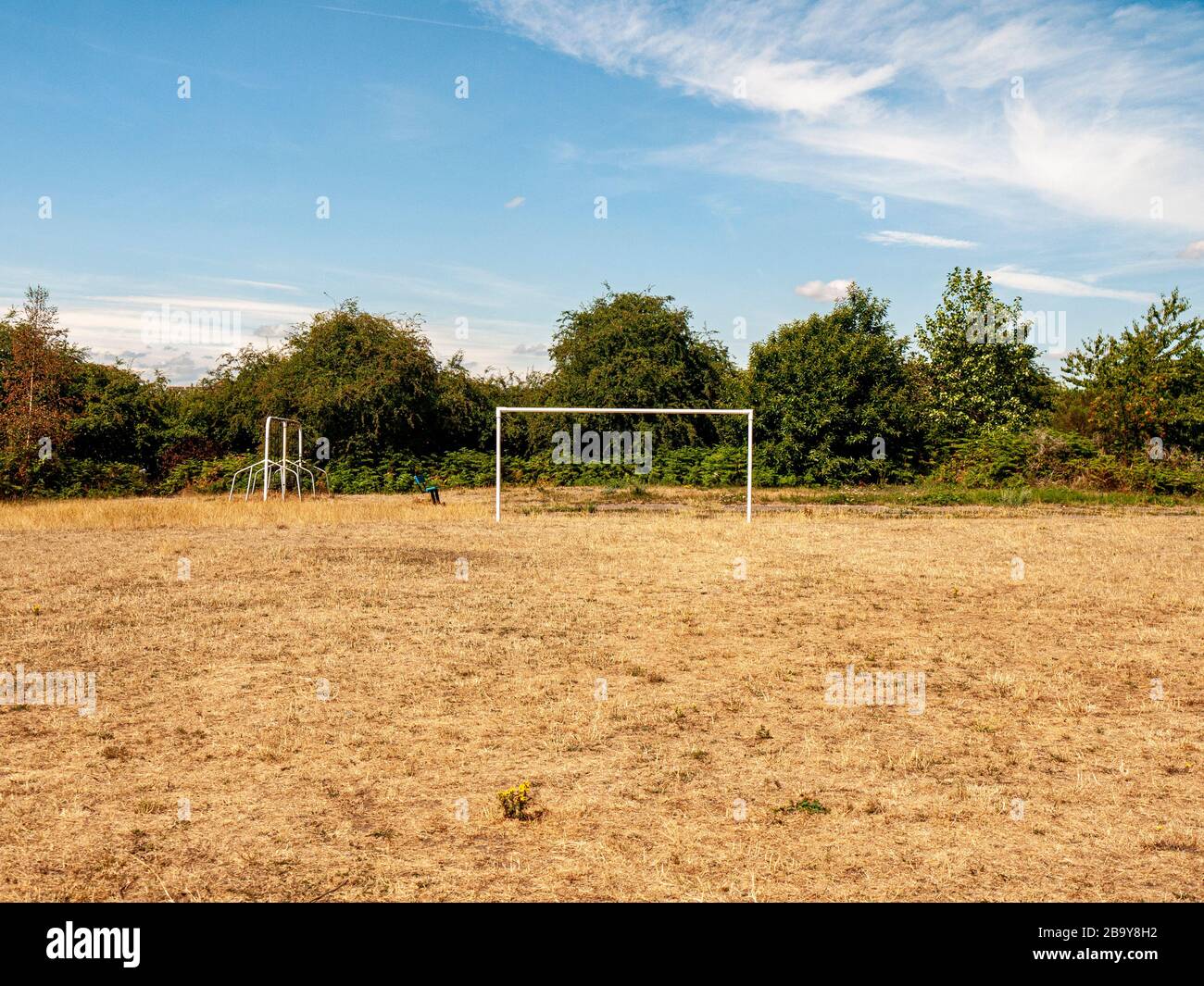 Football pitch after heatwave on children's playground in Cheshire UK ...