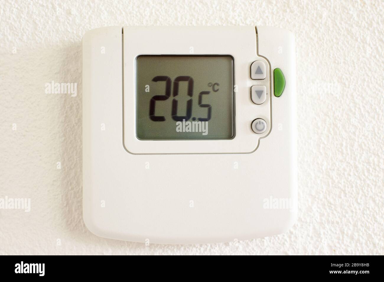 Digital climate control with white wall in the background Stock Photo ...