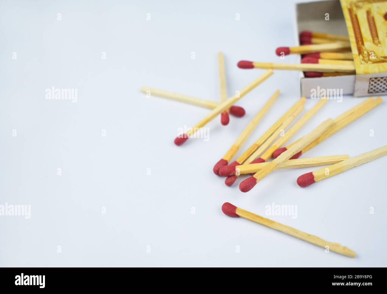 Close up picture of some flammable red fire matches scattered beside a ...