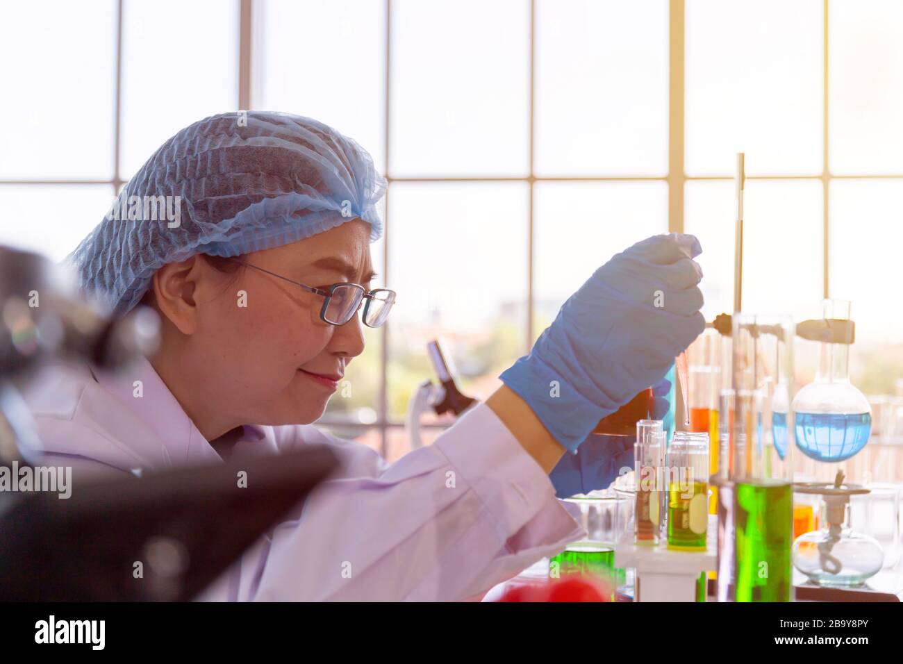 Discovering a cure for an Asian female scientist who is concentrated ...