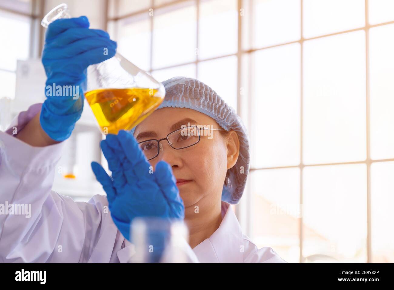 Discovering a cure for an Asian female scientist who is concentrated ...