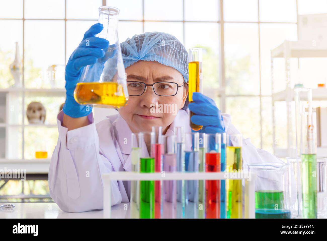 Discovering a cure for an Asian female scientist who is concentrated ...