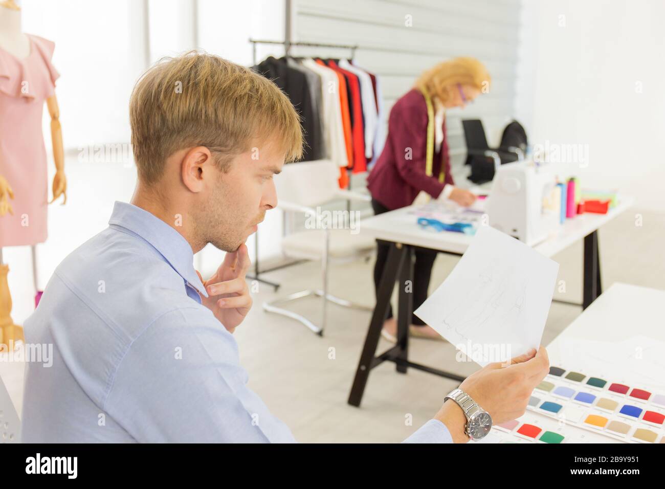 Professional team work designers, young men and elderly women in the ...