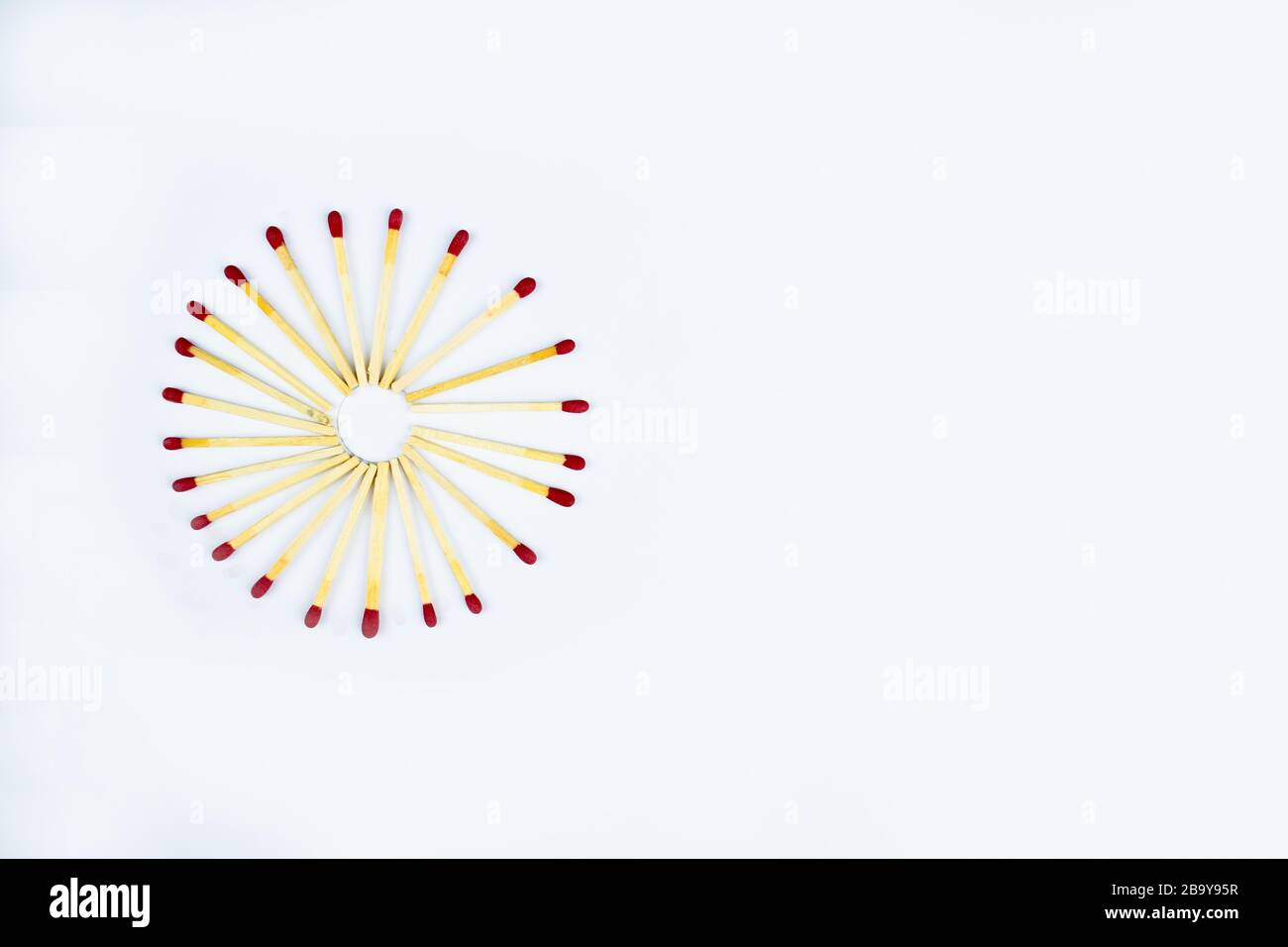 Photo of a circle made with flammable red fire matches on a white paper ...