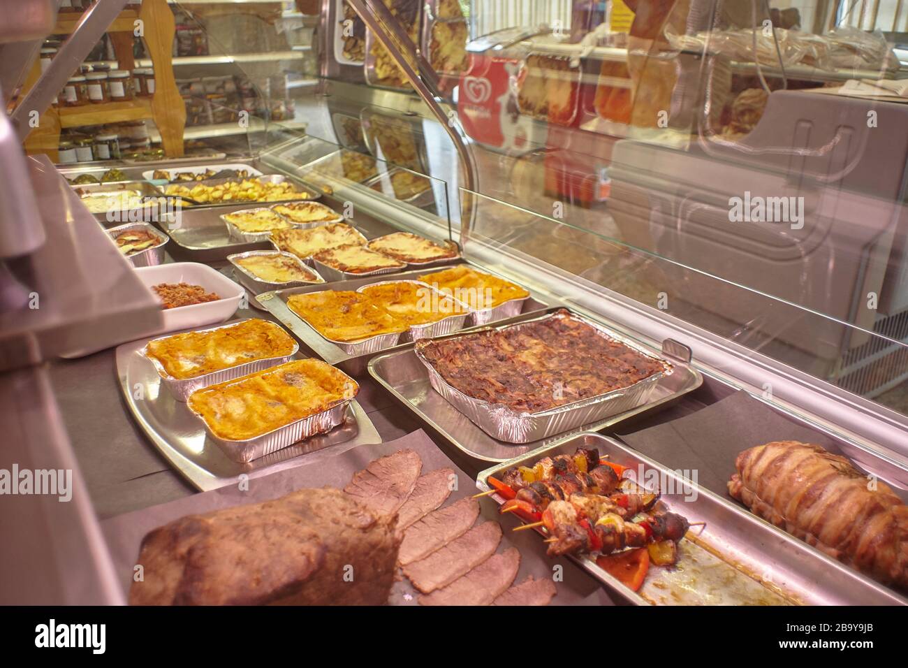 Rotisserie counter with dishes ready Stock Photo - Alamy