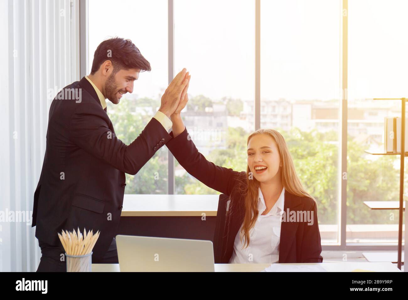 The two business men and women showed signs of joy and clapping Stock ...