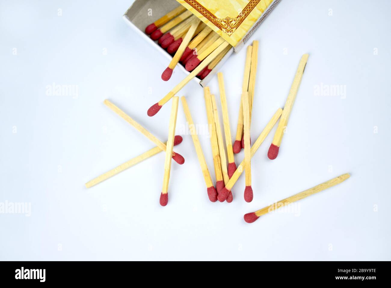Top view picture of some flammable red fire matches scattered beside a ...