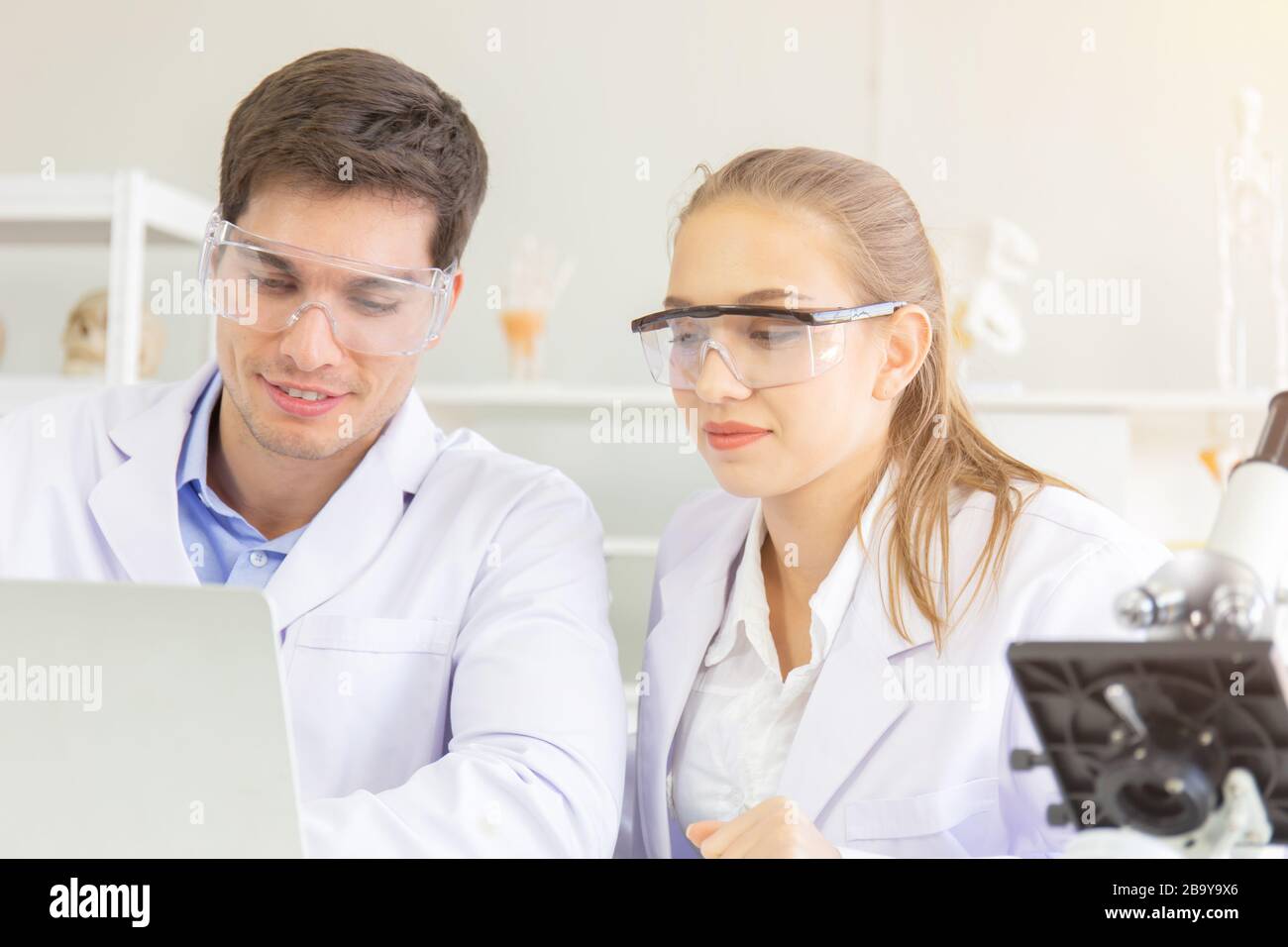 Young people working in the laboratory hi-res stock photography and ...