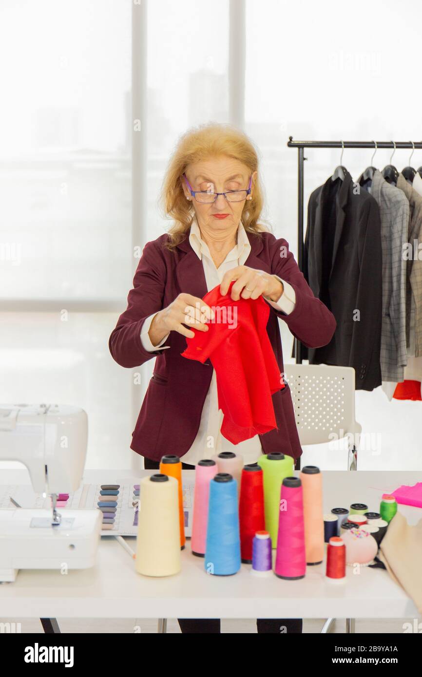 Professional female sewing designers in the office have a variety of ...