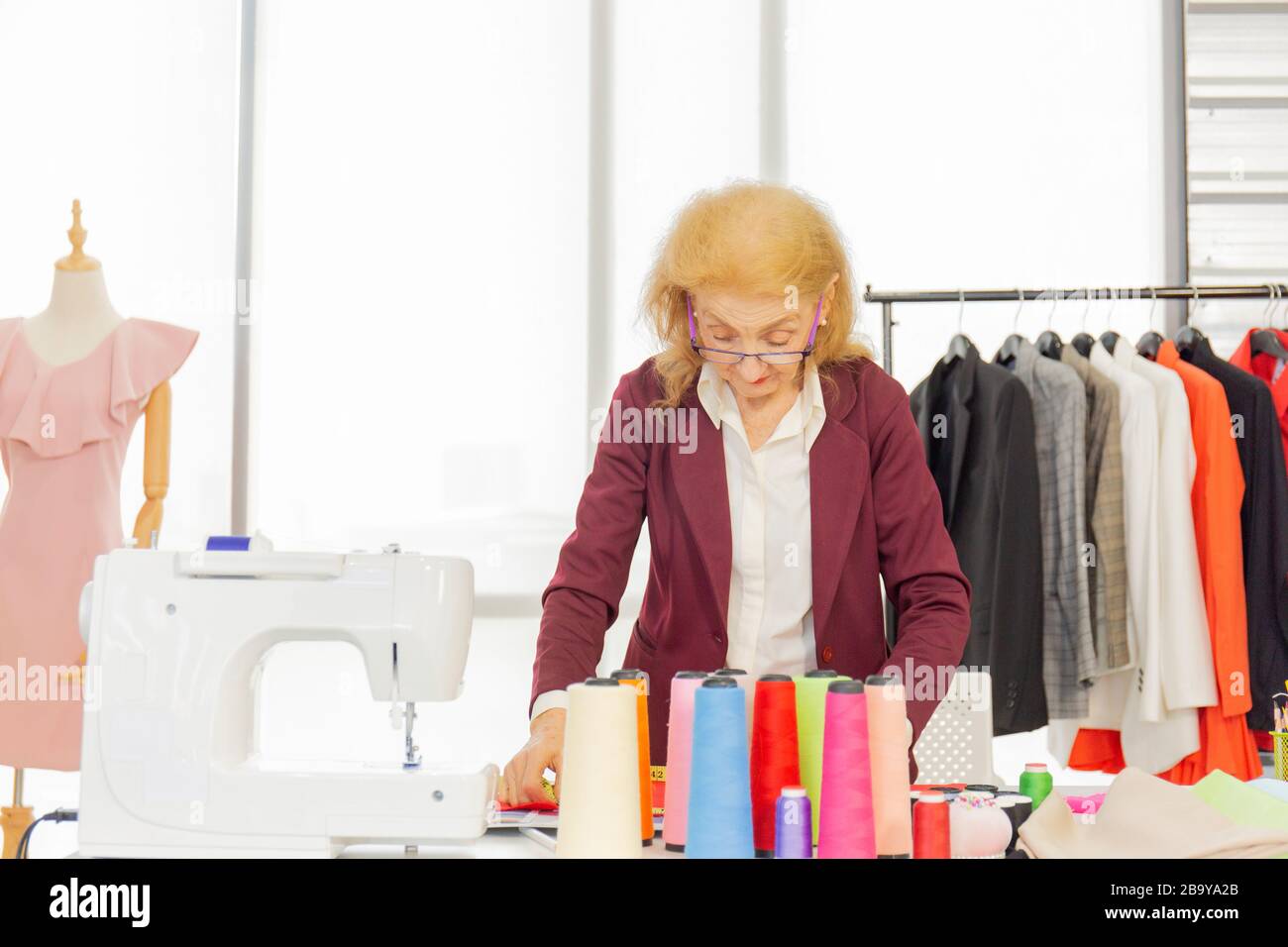 Professional female sewing designers in the office have a variety of ...