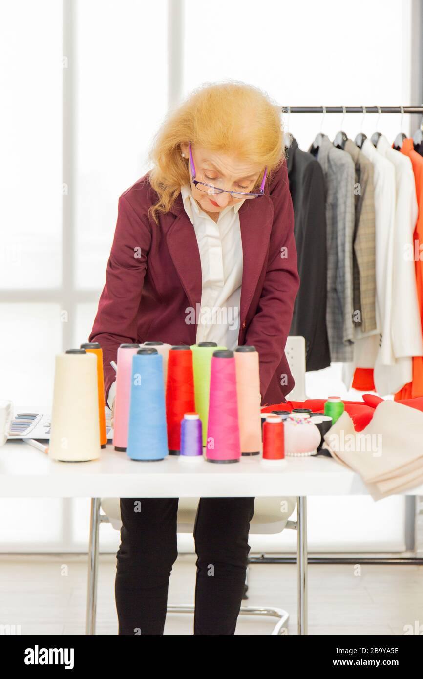 Professional female sewing designers in the office have a variety of ...