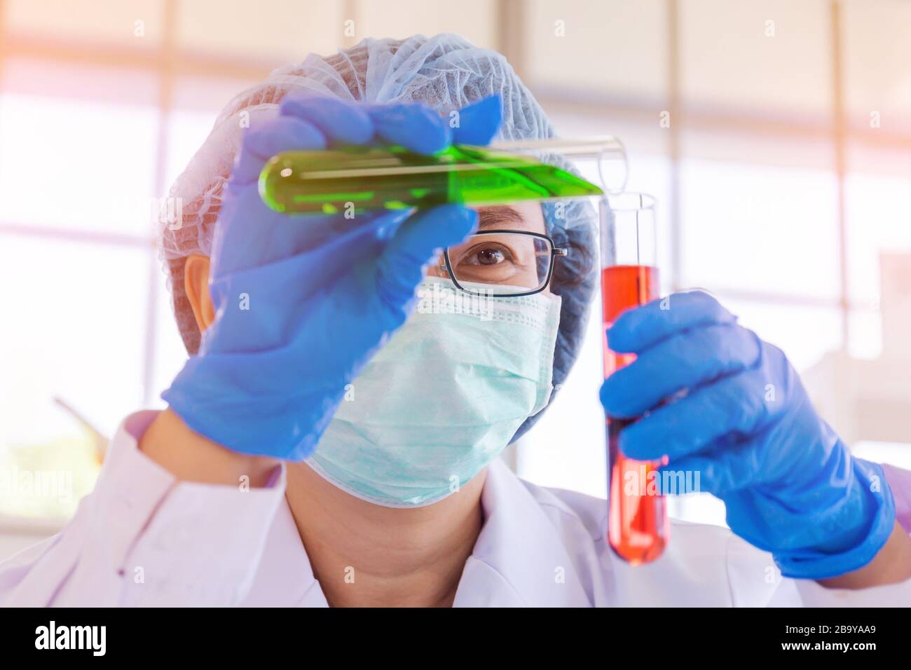 Scientist work in gloves hi-res stock photography and images - Alamy