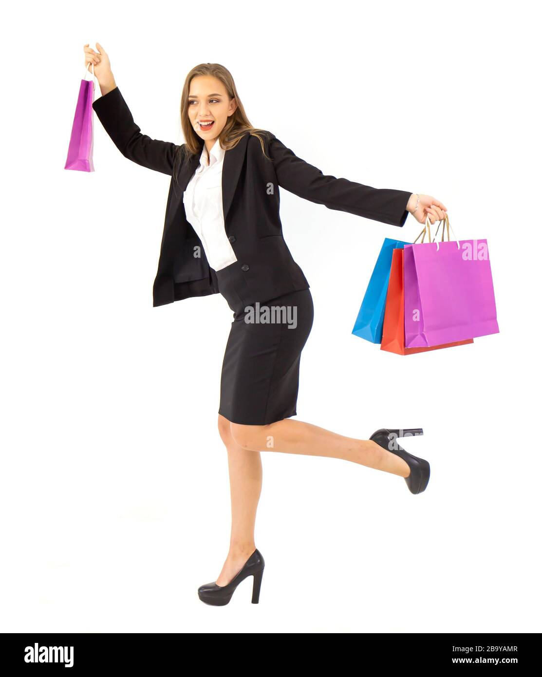 Girl in hand holding a shopping paper bag isolated on white background ...