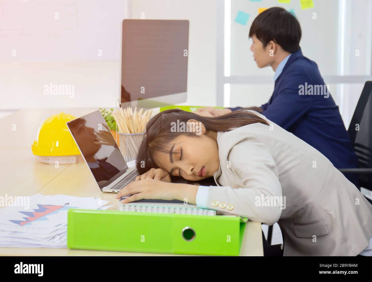Young woman sleep desk hi-res stock photography and images - Alamy