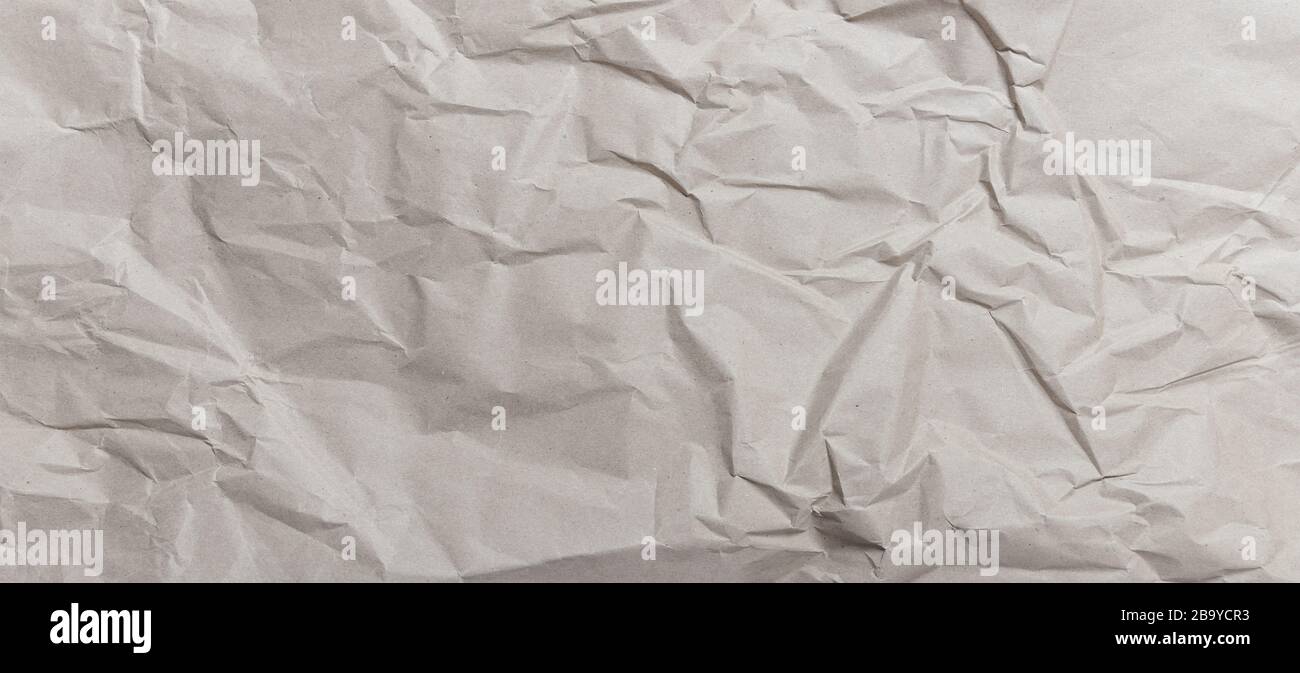 Texture of crumpled kraft or packing paper brown color. Wide-angle ...