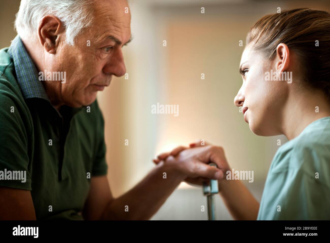 Old woman receiving bad news hi-res stock photography and images - Alamy